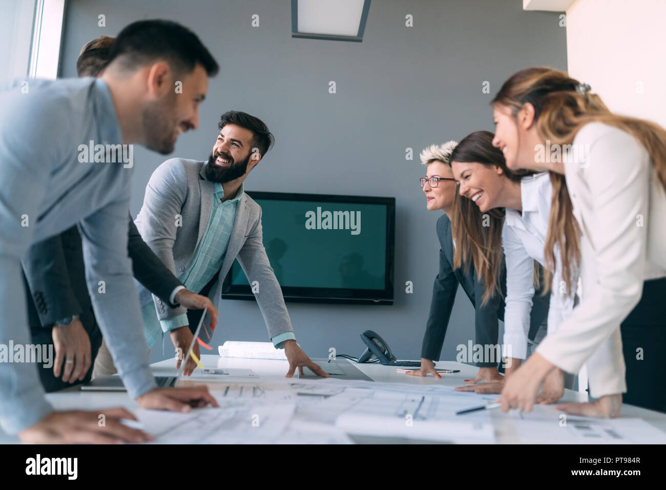 Group of business people collaborating in office Stock Photo - Alamy