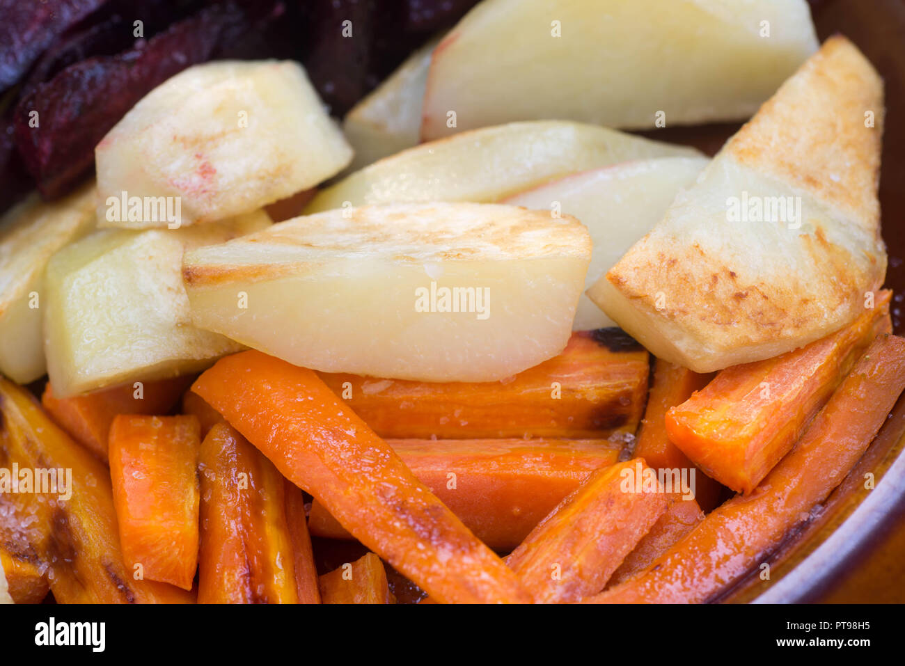 baked root vegetables on plate Stock Photo - Alamy