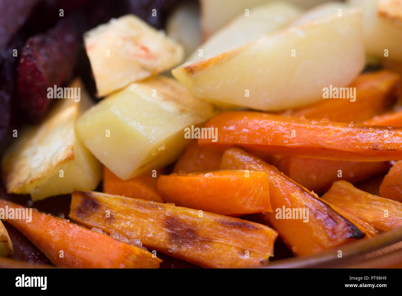 baked root vegetables on plate Stock Photo - Alamy
