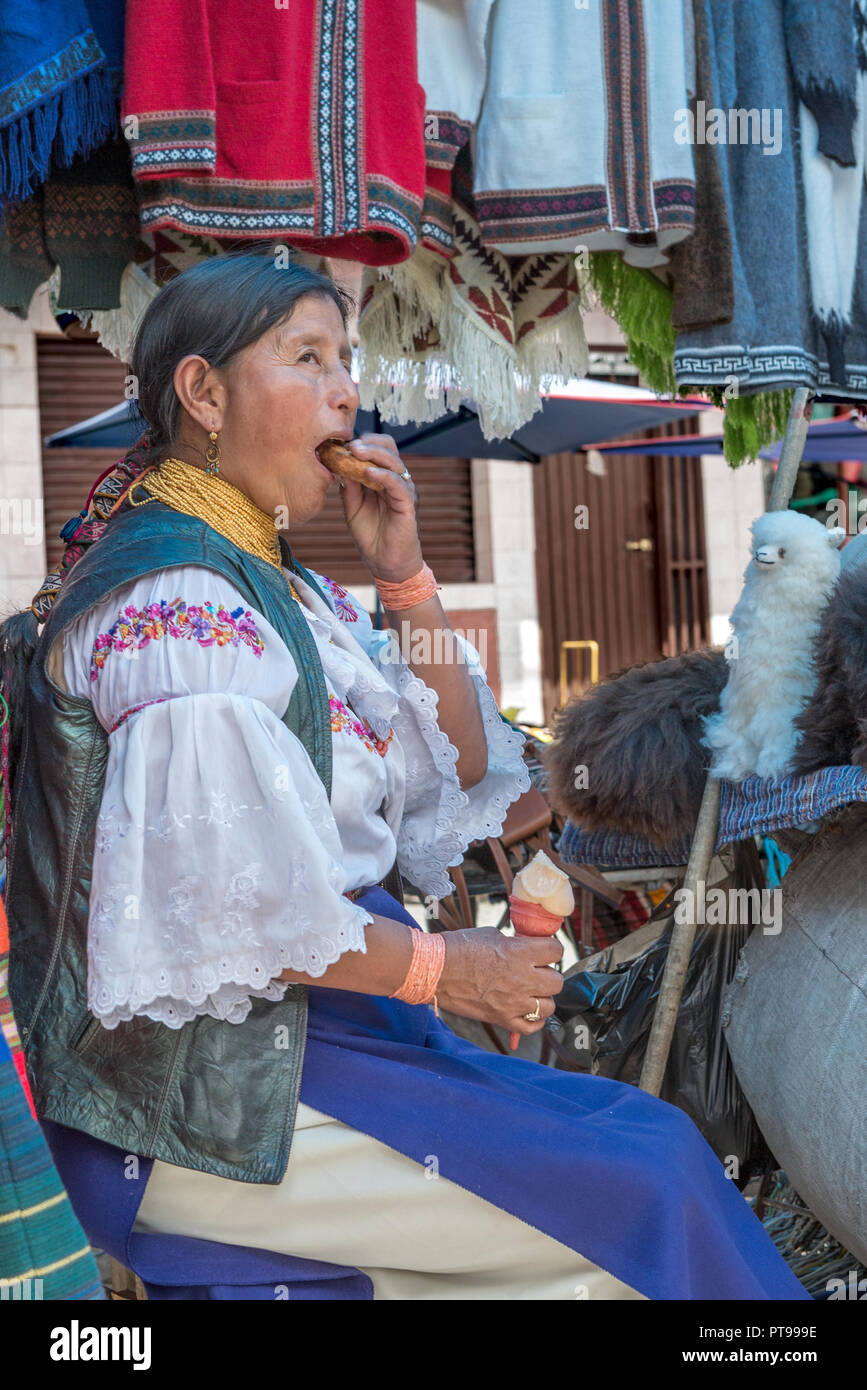 Otavalo market Ecuador - clothing + vendor Stock Photo - Alamy