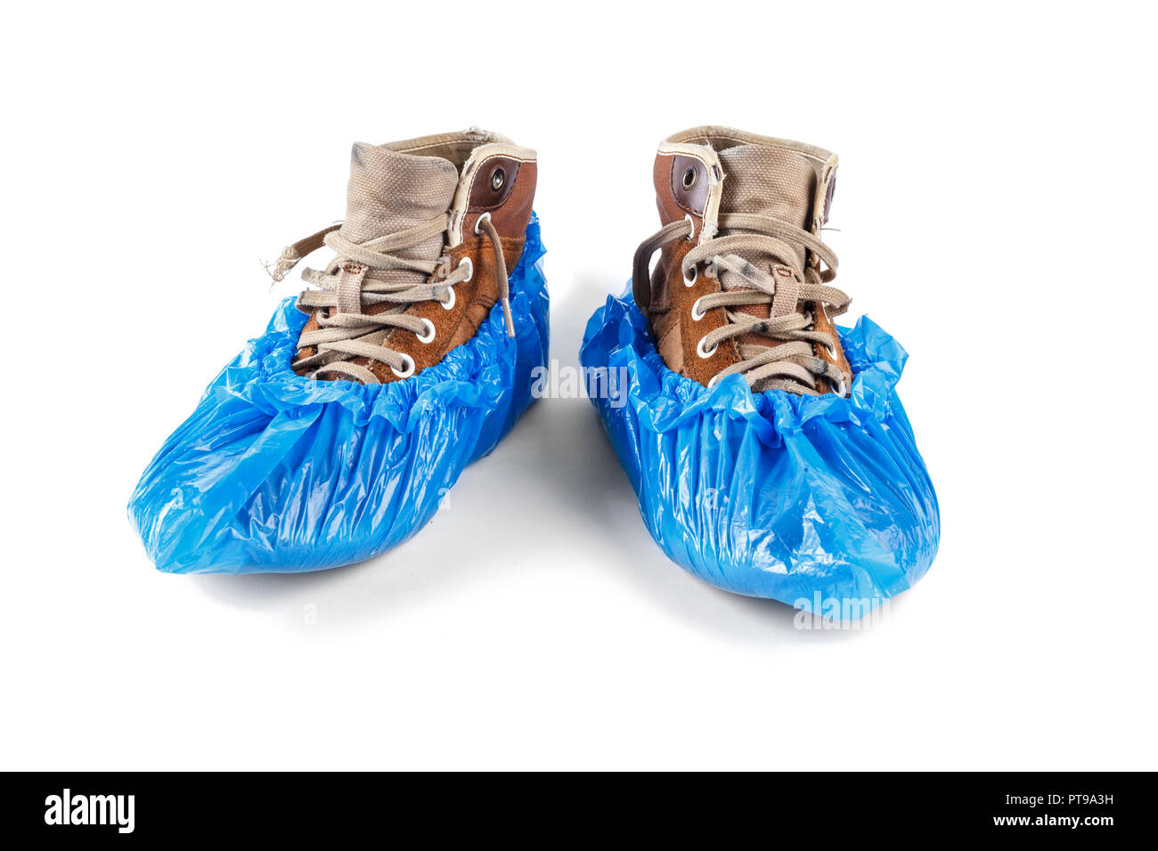 Mens shoes in blue shoe covers isolated on white background Stock Photo ...