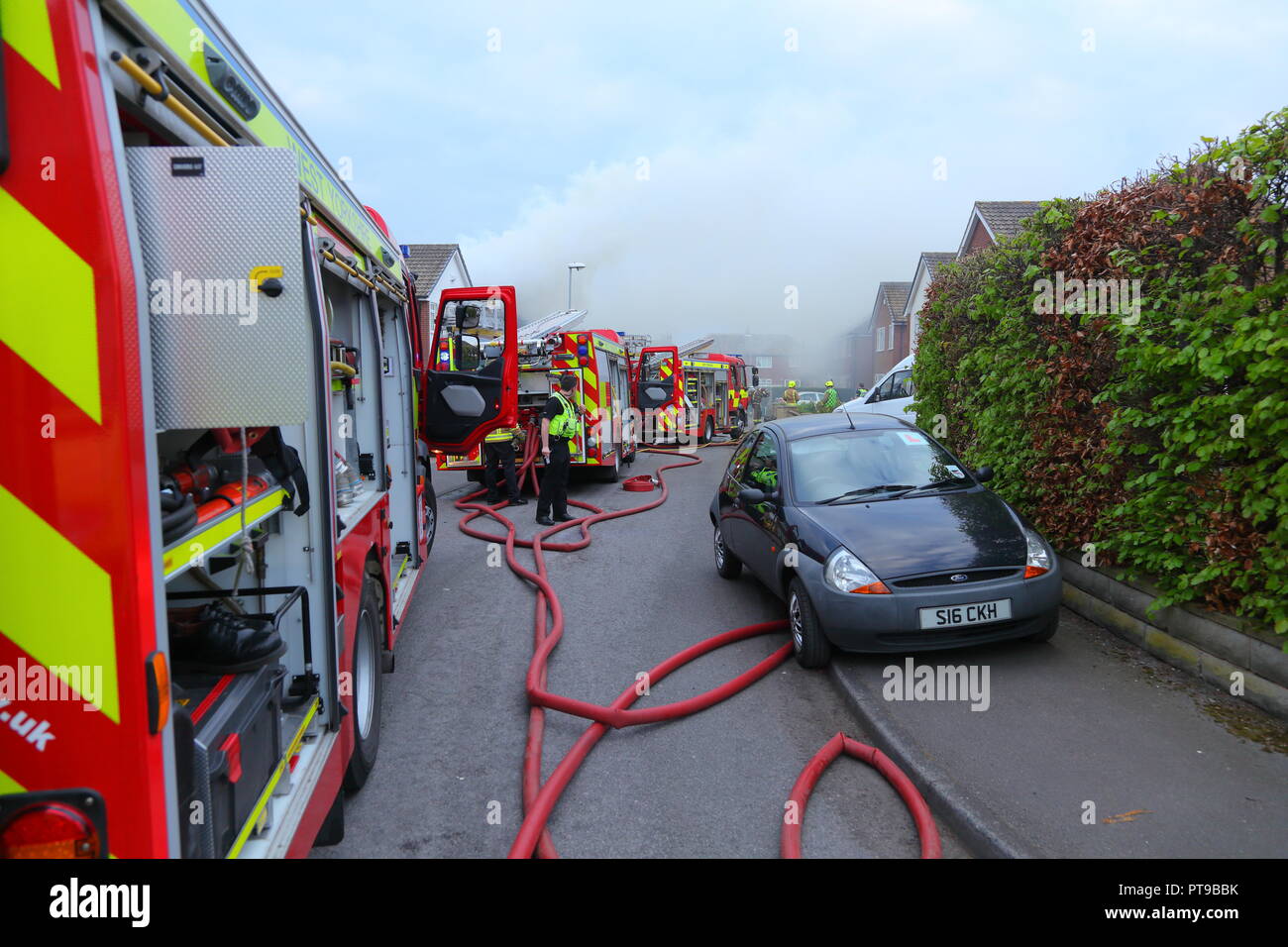 Emergency service vehicles at the scene of a fatal house fire in ...