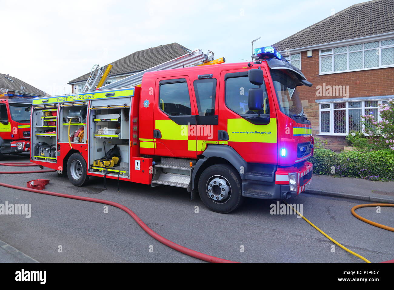 Emergency service vehicles at the scene of a fatal house fire in ...