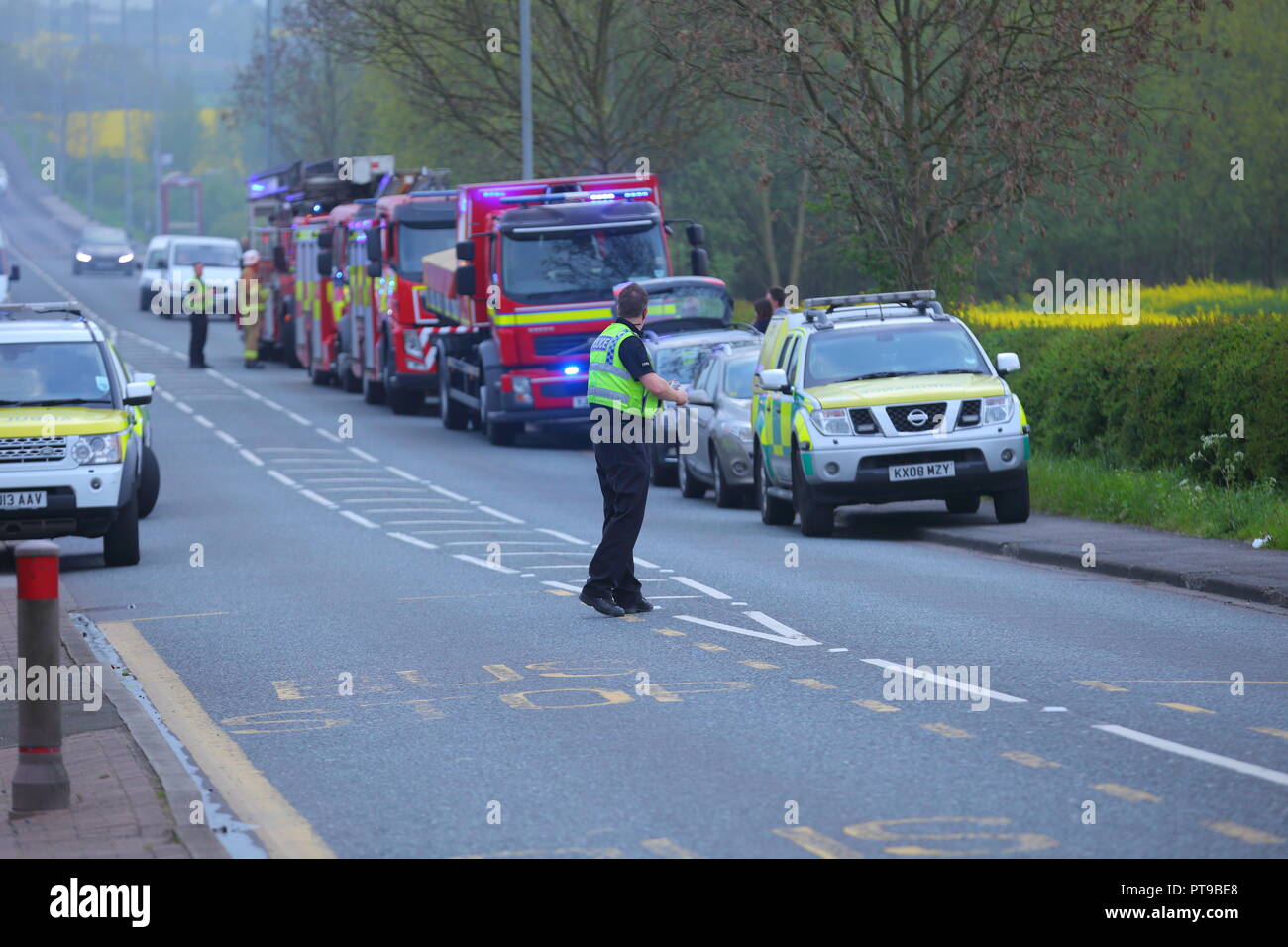 Emergency service vehicles line up Wakefield Road in Garforth after a ...
