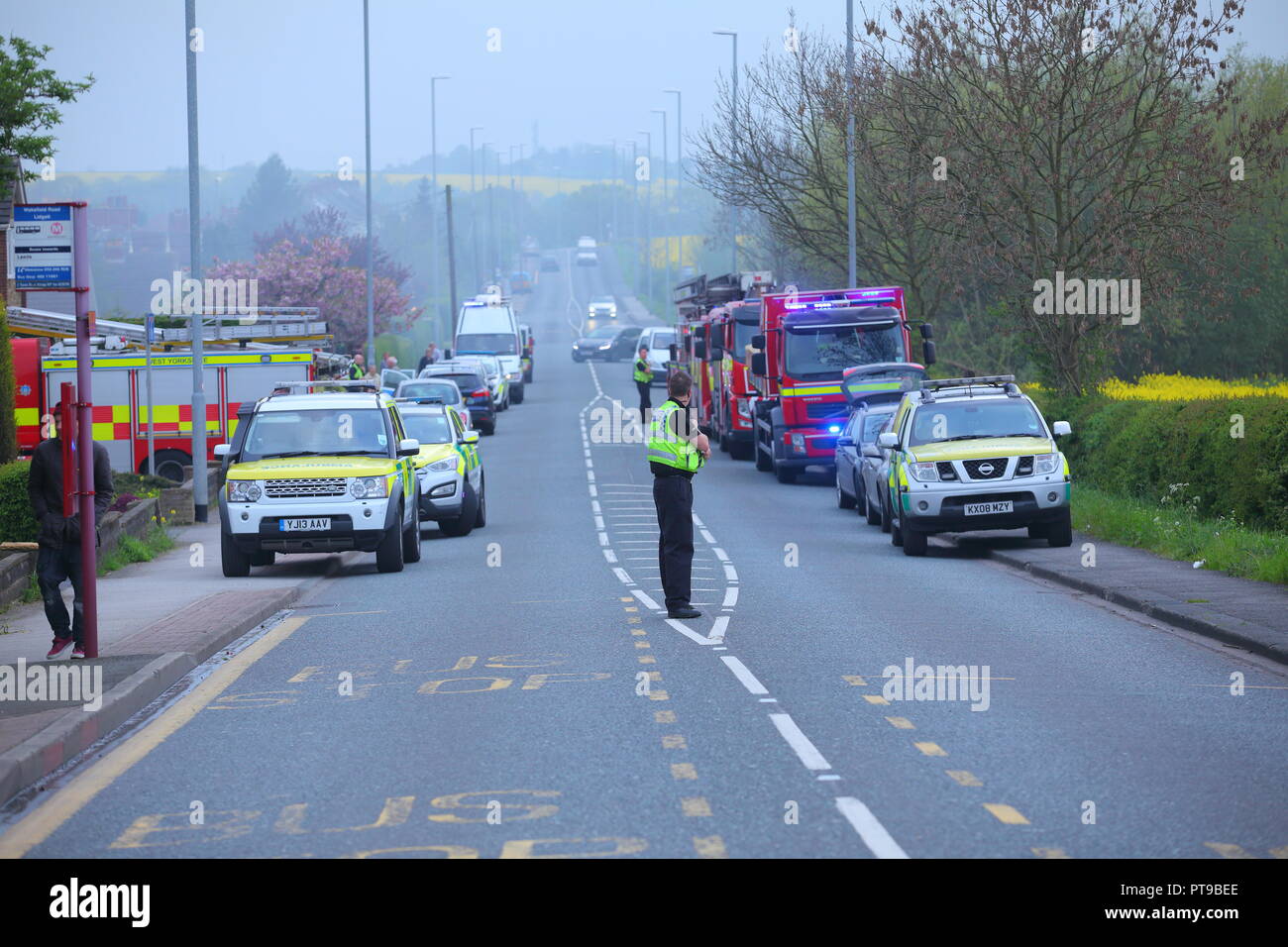 Emergency service vehicles line up Wakefield Road in Garforth after a ...