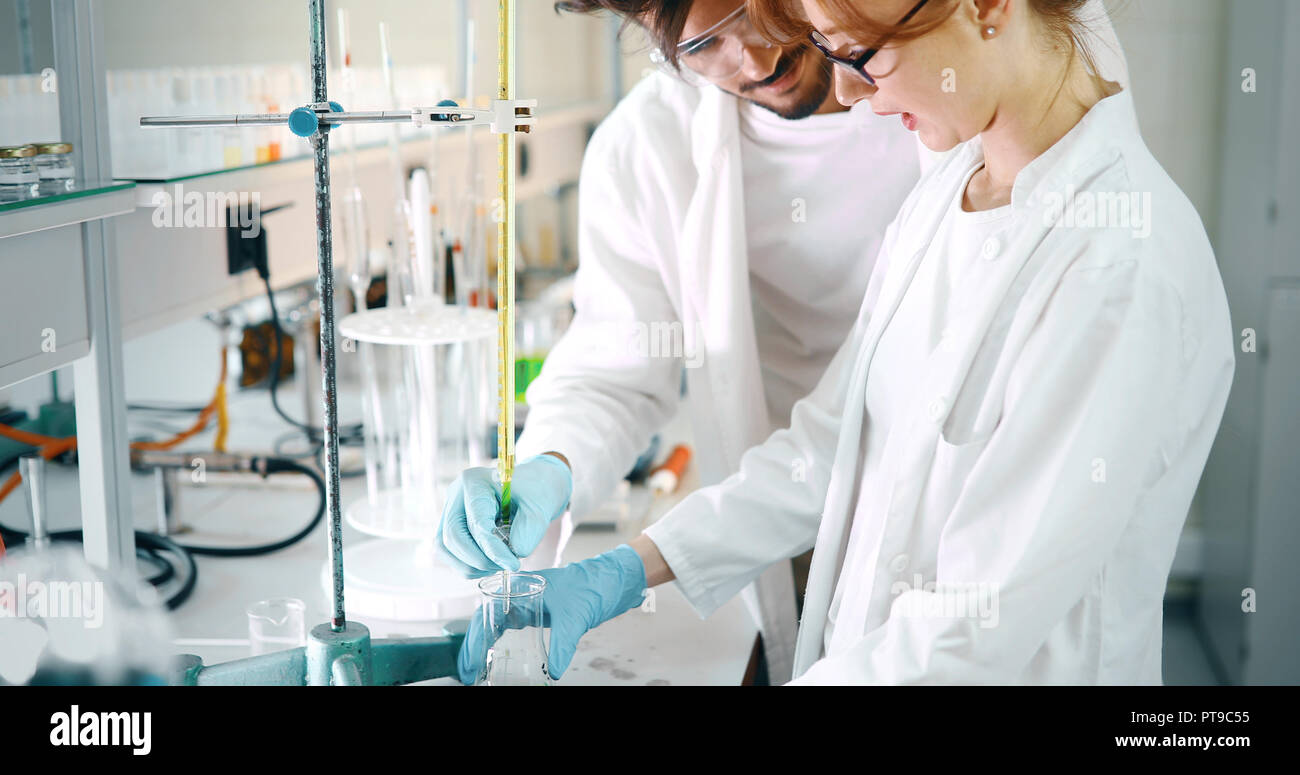Young students of chemistry working in laboratory Stock Photo - Alamy