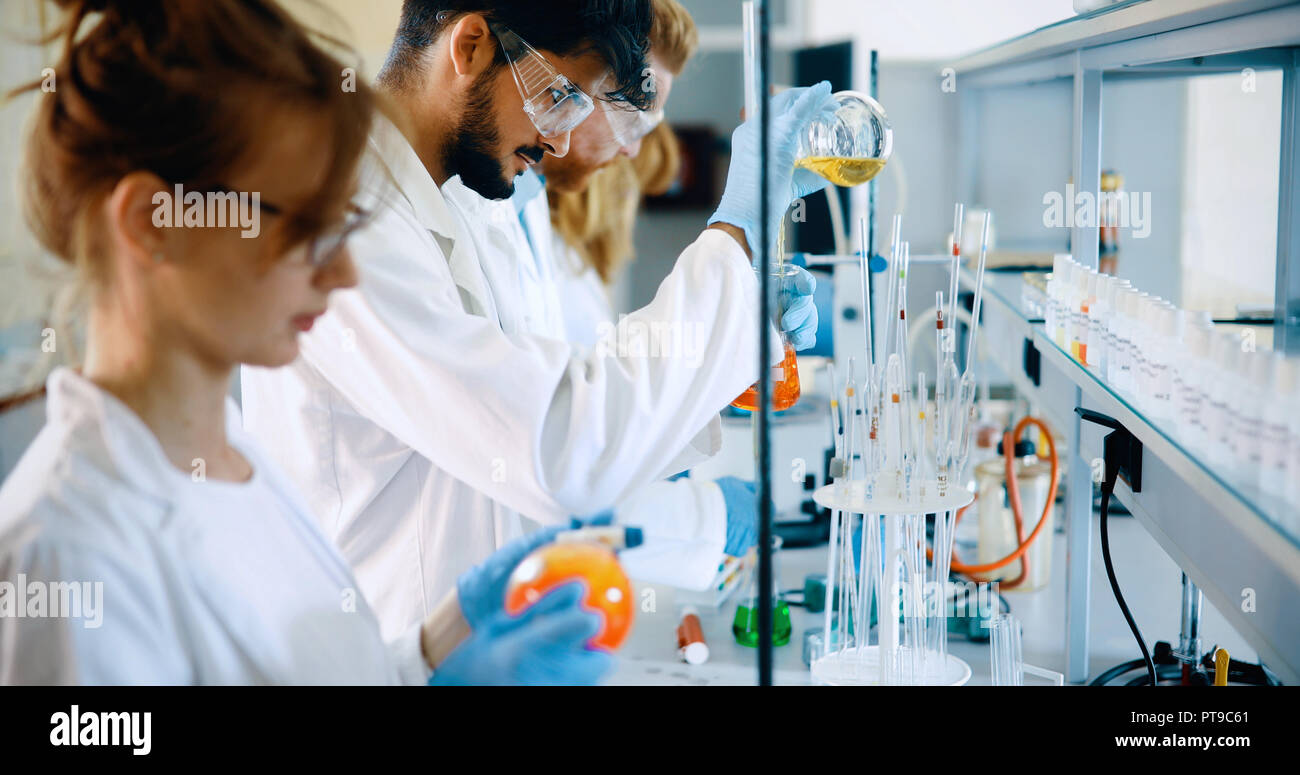 Young students of chemistry working in laboratory Stock Photo - Alamy