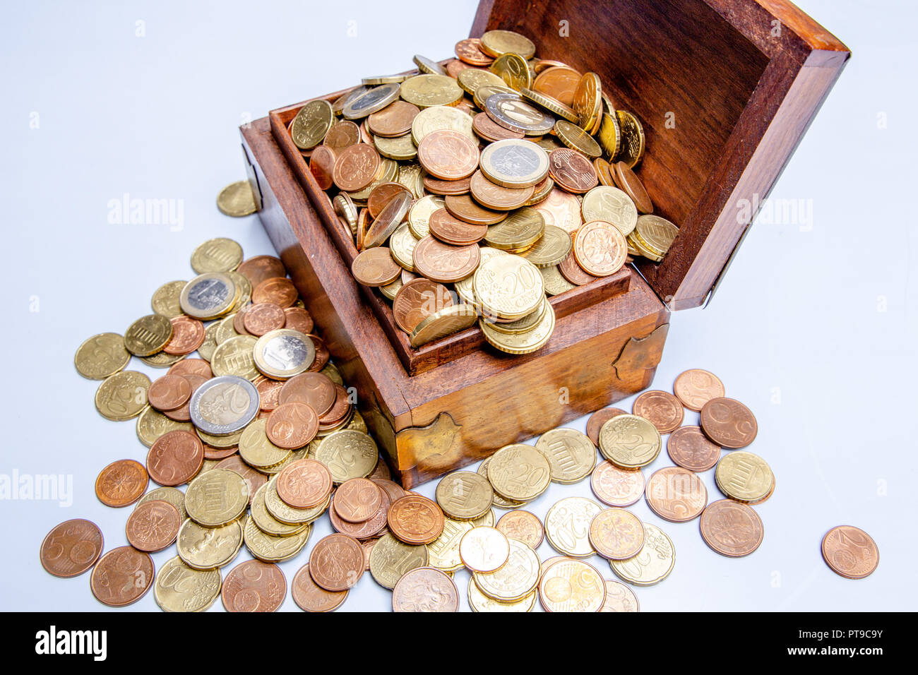 many euro coins in wooden box on white change the collect coins Stock ...