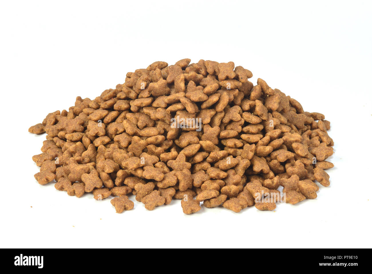 a pile of cat food on white background Stock Photo - Alamy