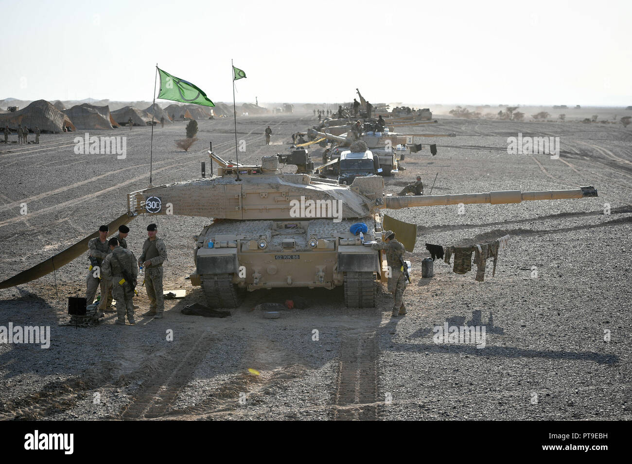 Challenger II Main Battle Tank crews take shade in the Oman desert ...