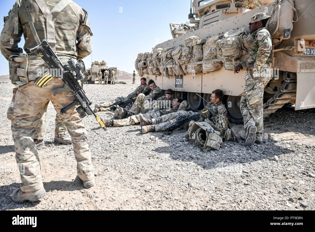 British soldiers take shade from the searing heat of the Oman desert ...