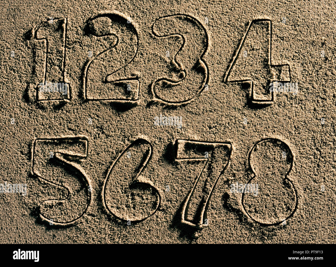 The numbers 1 to 8 cut into wet sand Stock Photo - Alamy