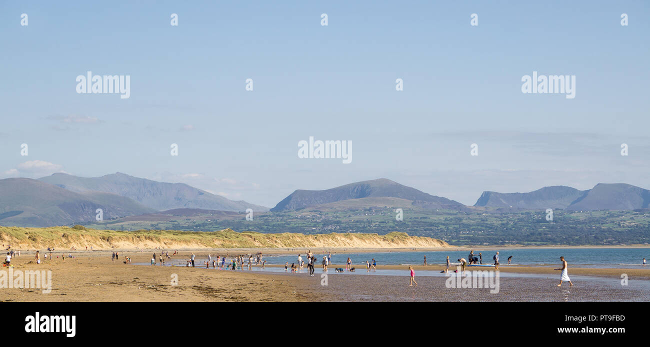Panoramic landscape: families on Newborough Warren beach, Anglesey ...