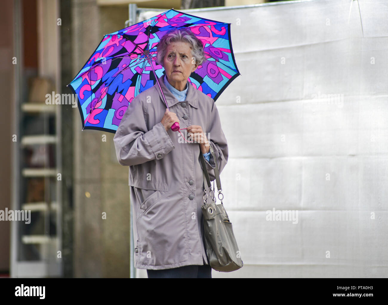 Elderly lady using a colourful umbrella. Vienna, Austria Stock Photo ...