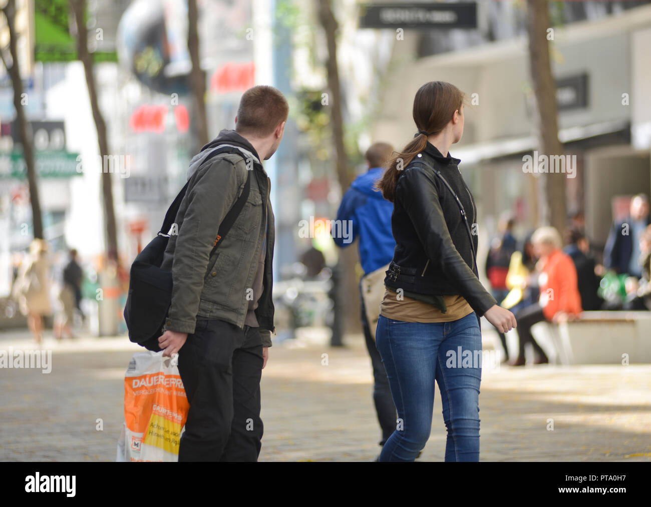 People turning their heads and looking back in the street. Vienna ...