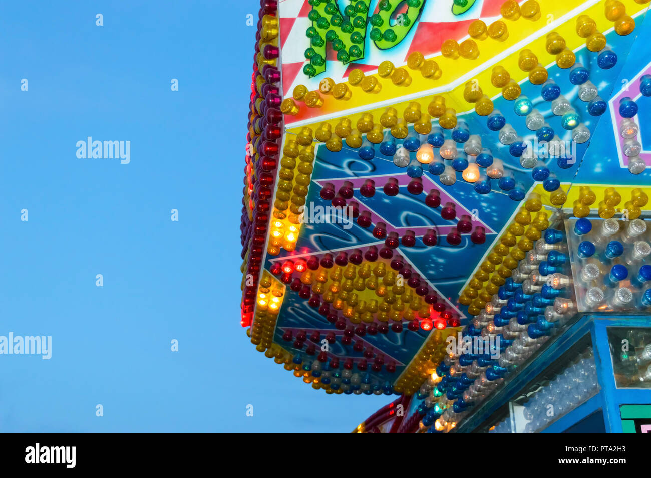 Amusement park. Beautiful bright building with burning lights close-up ...