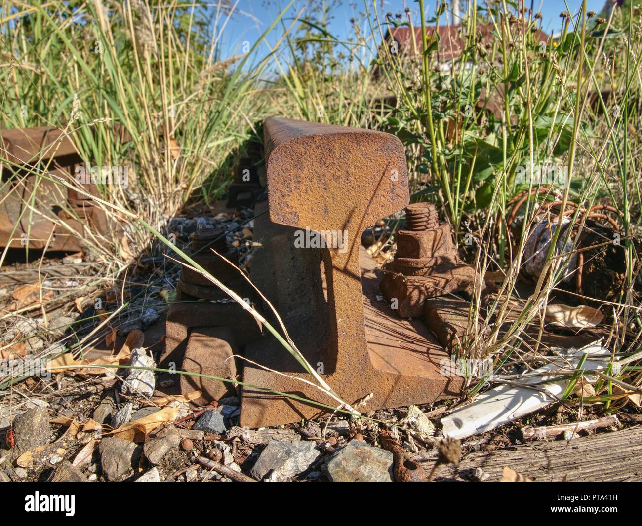 Old rusty railways. Railway details of rails joint with screws and nuts ...
