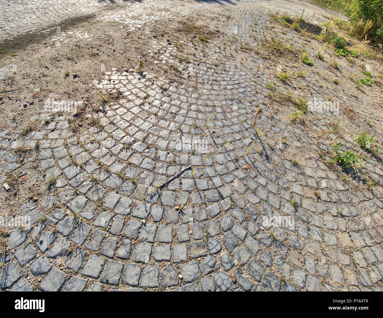 Old ruin coblestone road. Stone pavement texture. Granite cobblestoned ...