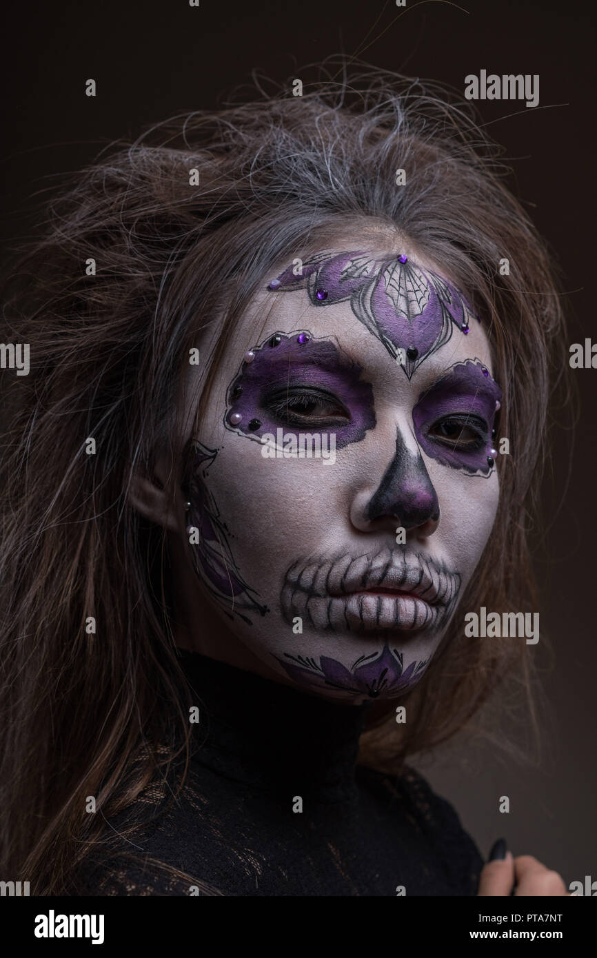 Portrait of a girl with a make-up dead man on Halloween Stock Photo - Alamy