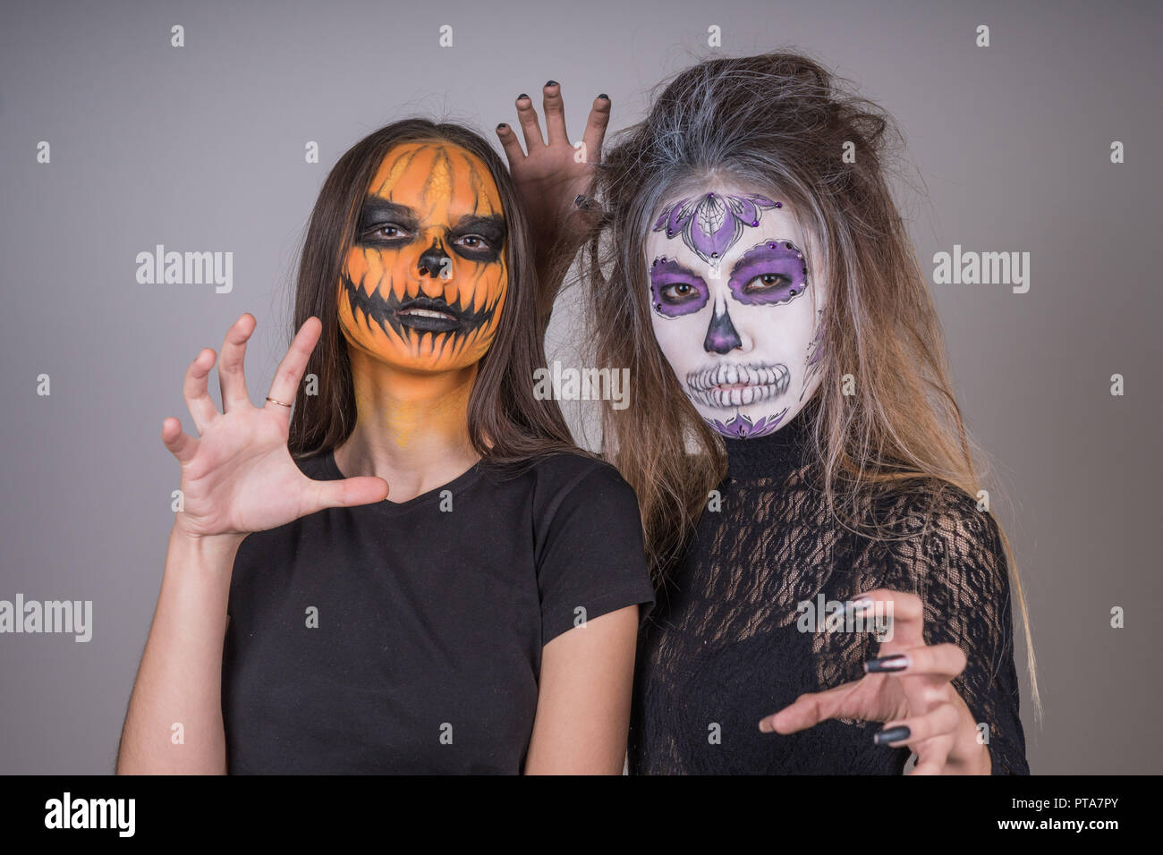 Young girls with horrific faces of the dead in honor of the holiday of ...
