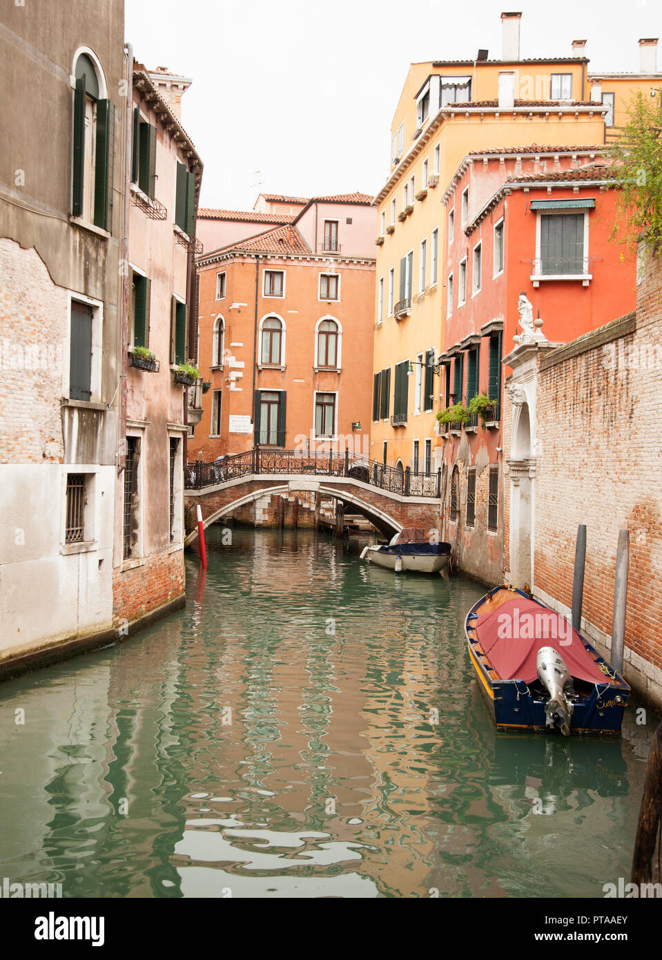 a canal waterway in Venice , Italy with bridges and boats along it ...