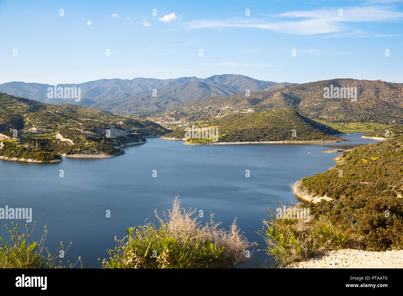 Cyprus landscape with mountains, lake and village Stock Photo - Alamy