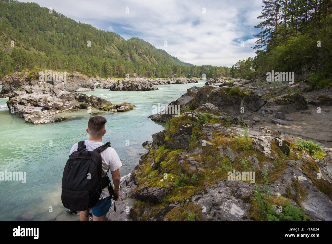 Man resting at river Stock Photo - Alamy