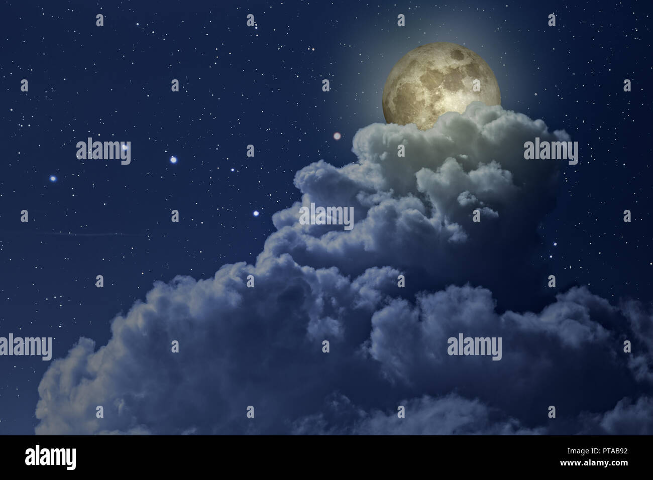 Colorful bright night with stars and full moon arising behind a strong ...