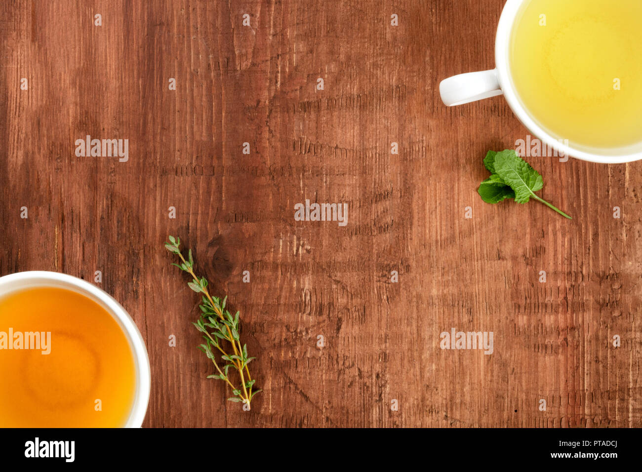 An overhead closeup photo of tea, on a dark rustic background with copy ...