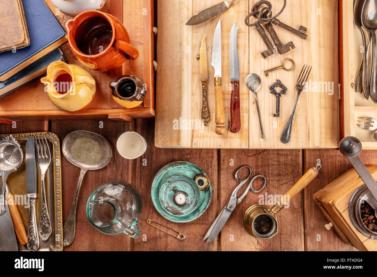 An overhead photo of many vintage objects, flea market stuff on a ...