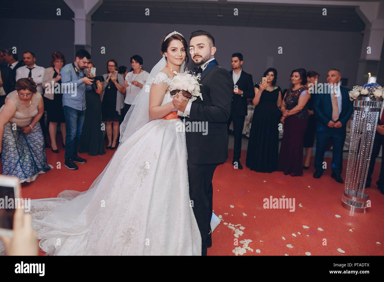 A beautiful young Turkish man wearing a black suit and a beard with his ...