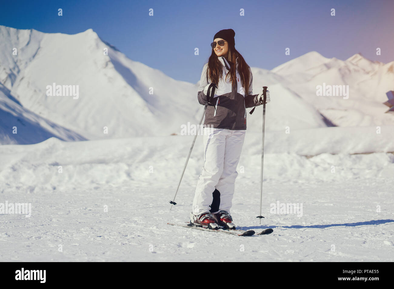 young and active brunette skiing in the snowy mountains Stock Photo - Alamy