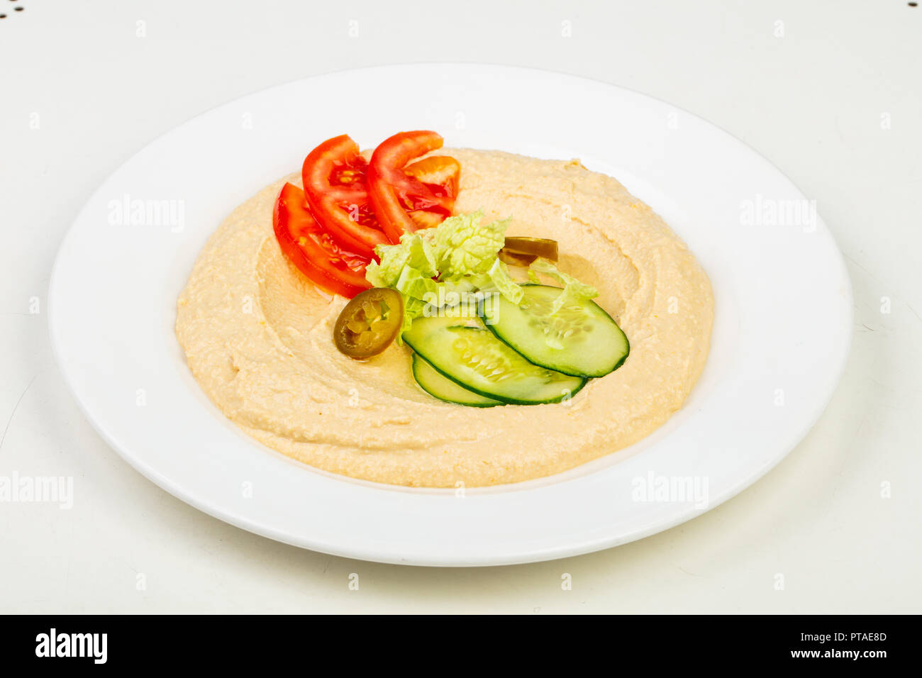Humus with vegetables and spices Stock Photo - Alamy