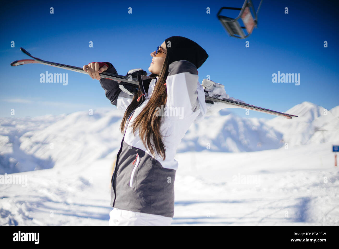young and active brunette skiing in the snowy mountains Stock Photo - Alamy
