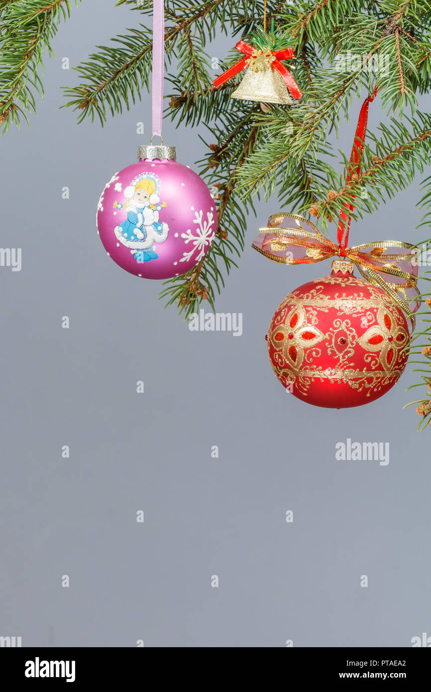 Branches of fir tree with balls, bell and other Christmas ornament on ...