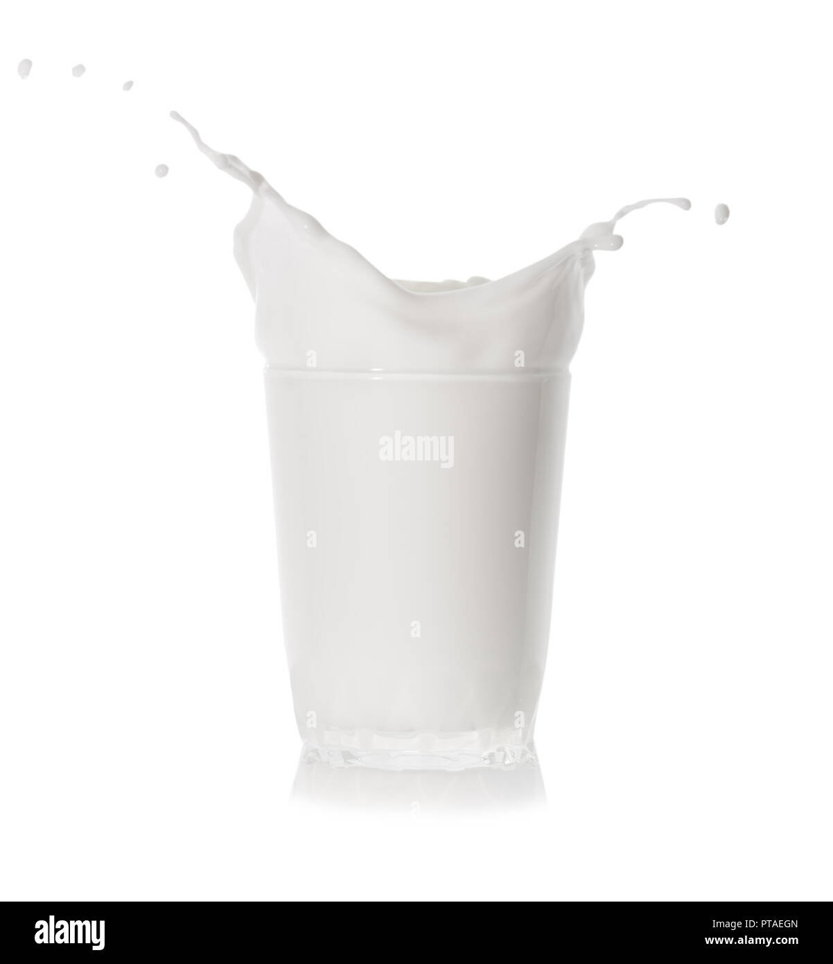 Splash of fresh cold milk in glass, transparent glass isolated on white ...