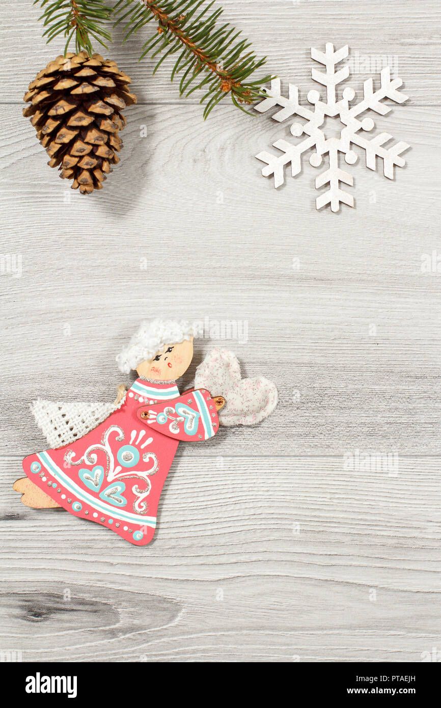 Natural fir tree branches with Christmas angel, cone and decorative ...