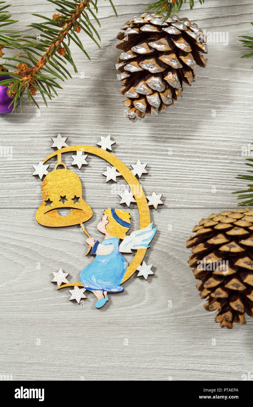 Natural fir tree branches with angel, cones and other Christmas ...