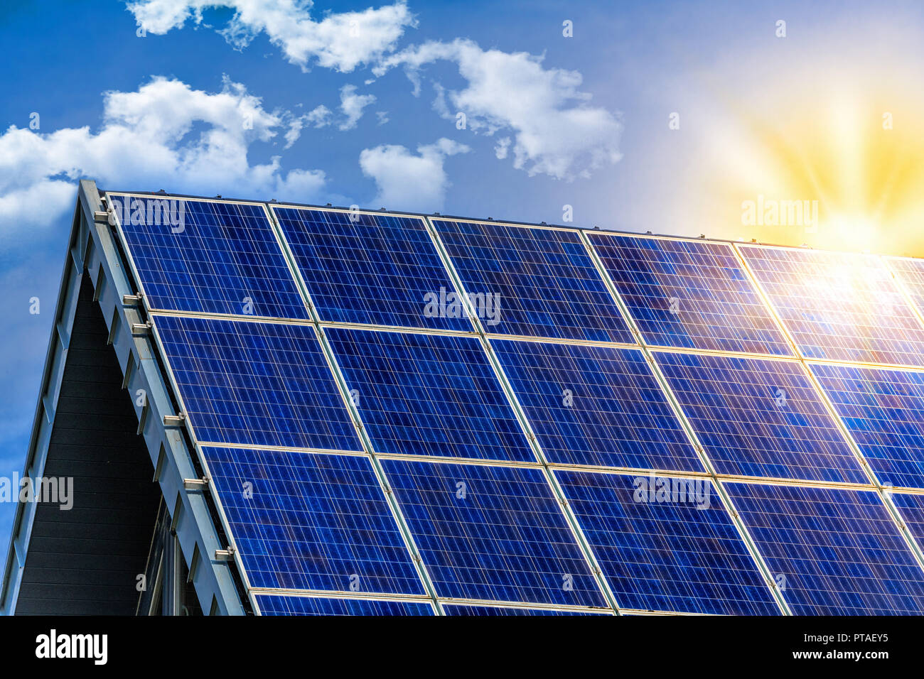 Solar panel with sun Stock Photo - Alamy