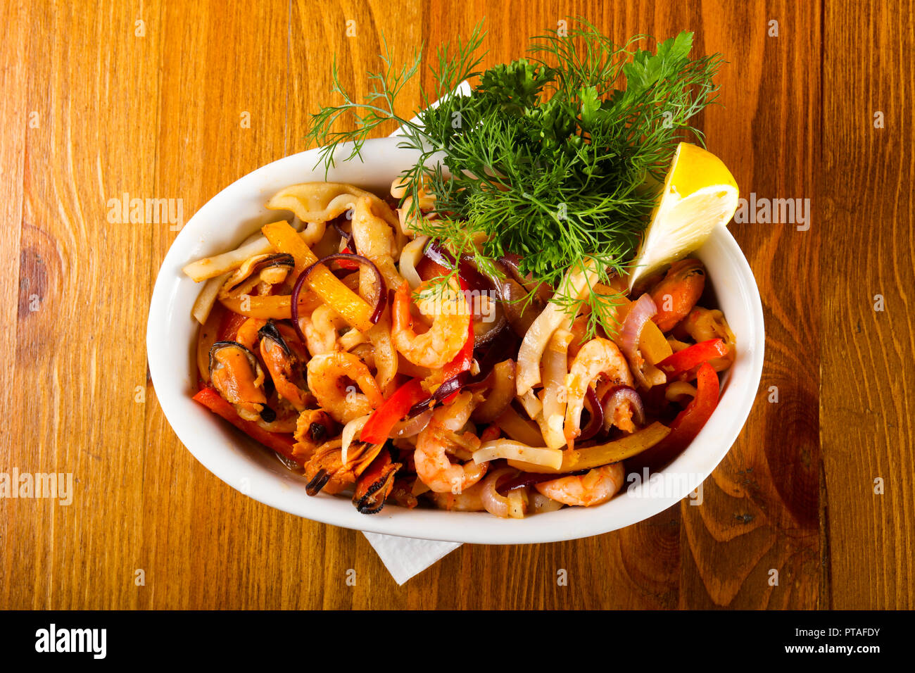 Seafood cocktail with squid, mussels and shrimps Stock Photo - Alamy