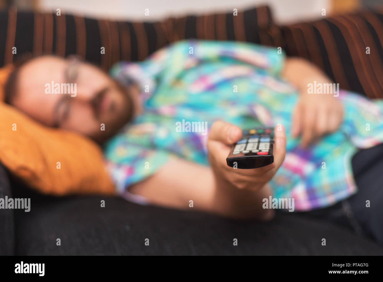 Sofa watching television lying hi-res stock photography and images - Alamy