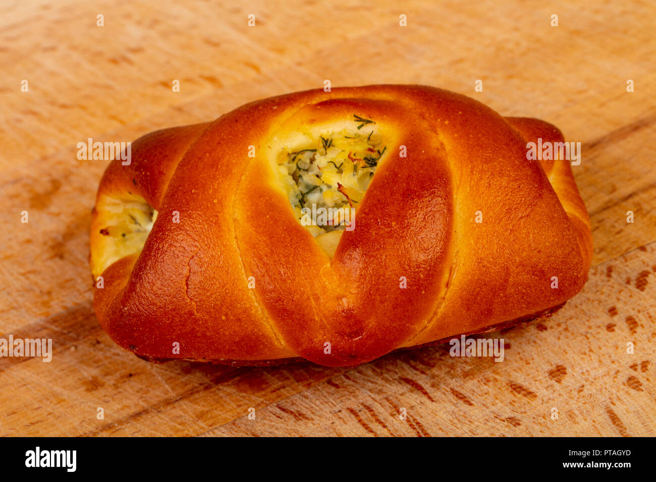 Tasty Stuffed pastry over wooden background Stock Photo - Alamy