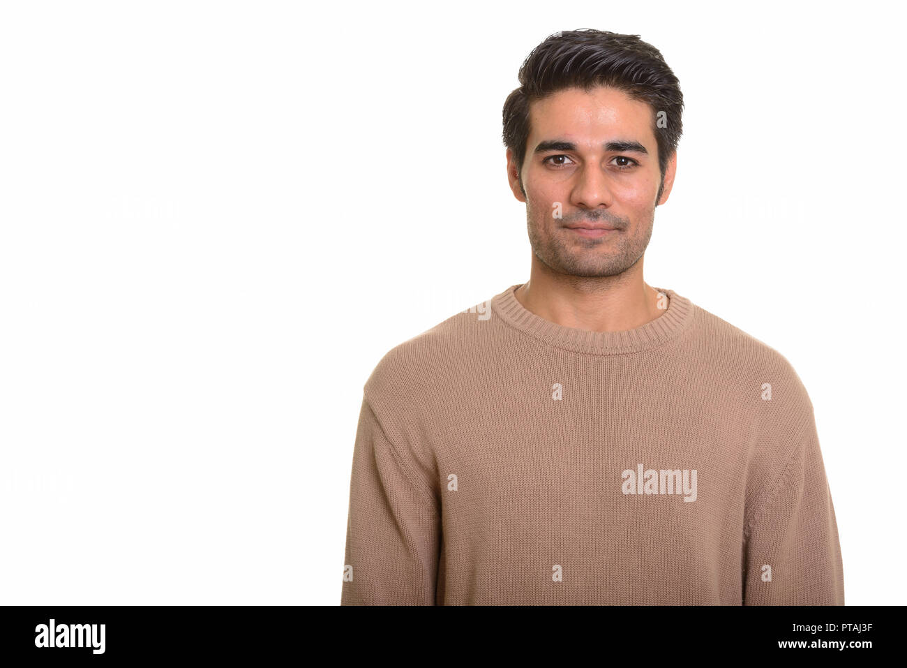 Young handsome Persian man against white background Stock Photo - Alamy