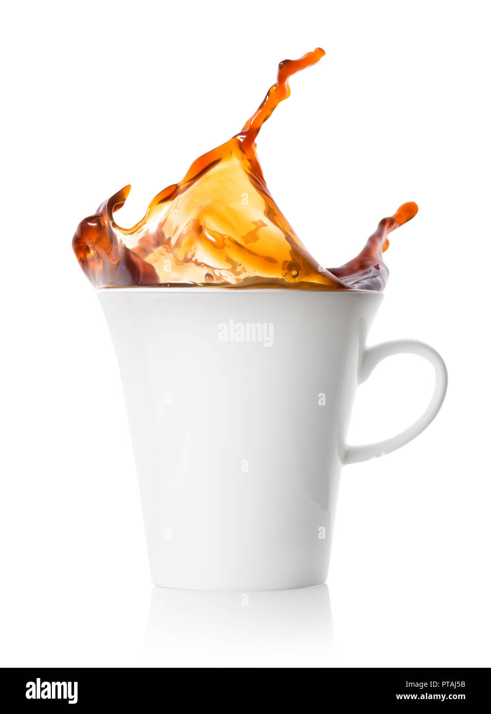 Splash in white porcelain cup of black coffee isolated on white ...