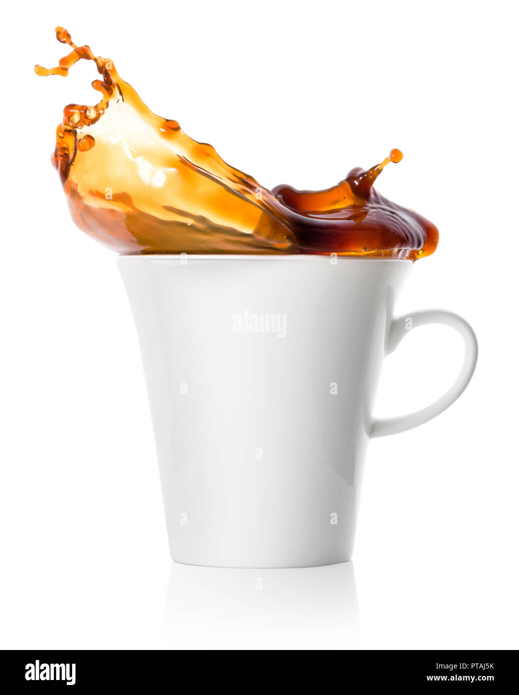 Splash of black coffee in white porcelain cup isolated on white ...