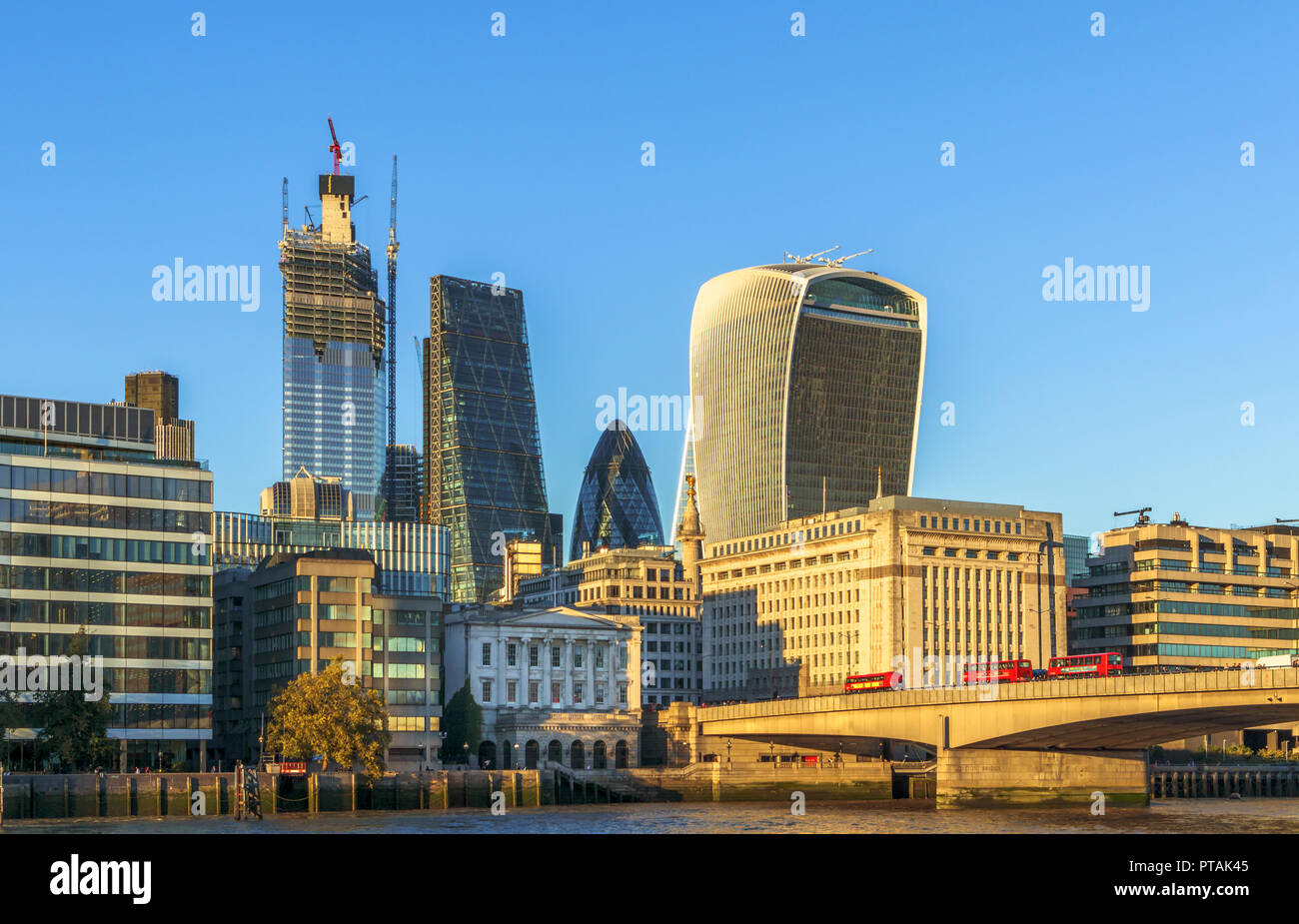 Golden hour view of the skyline of the City of London financial ...