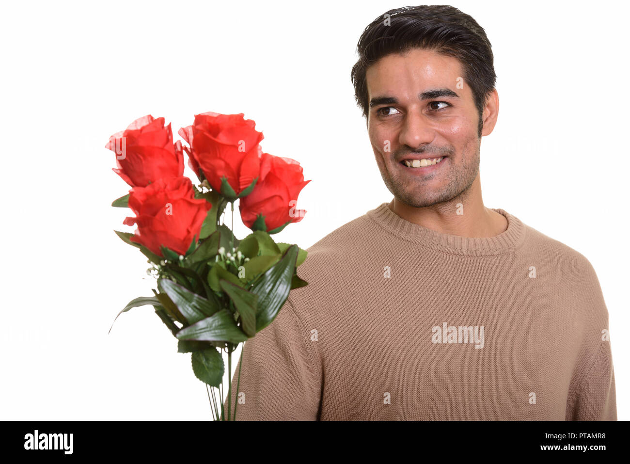 Young handsome Persian man against white background Stock Photo - Alamy