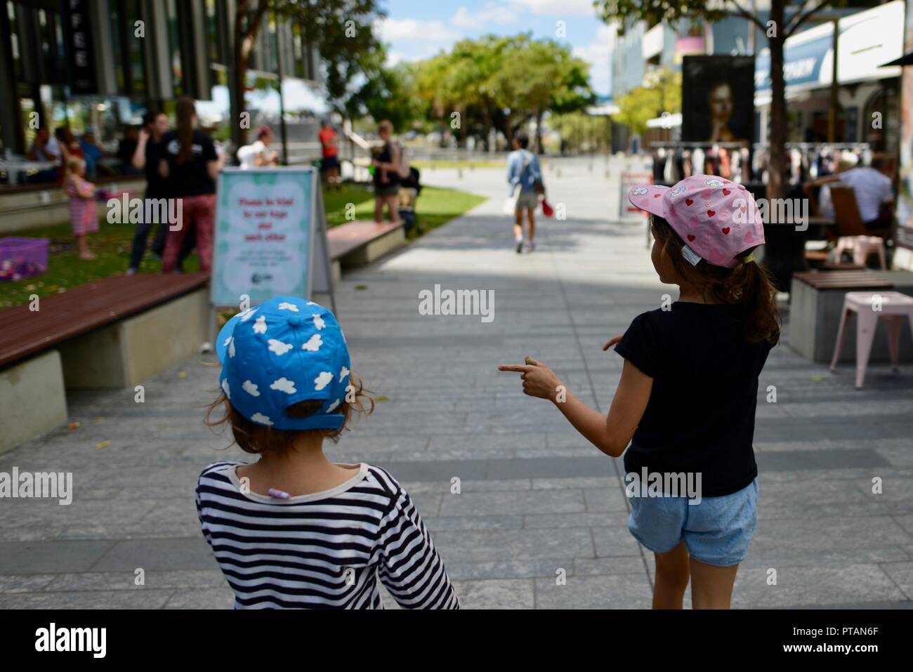 Children walking along a city street, The Cotters market on Flinders ...