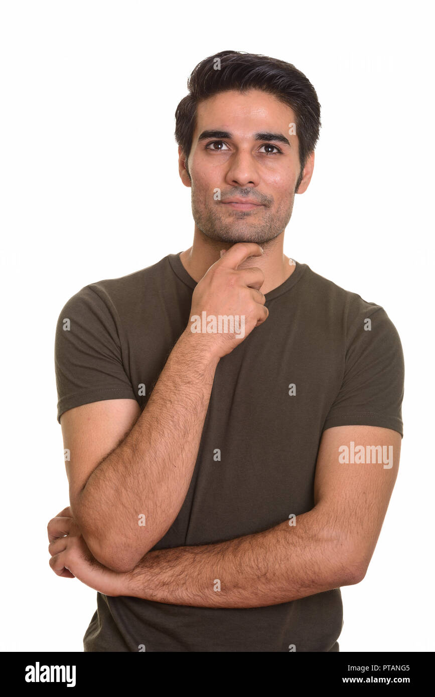 Young handsome Persian man against white background Stock Photo - Alamy