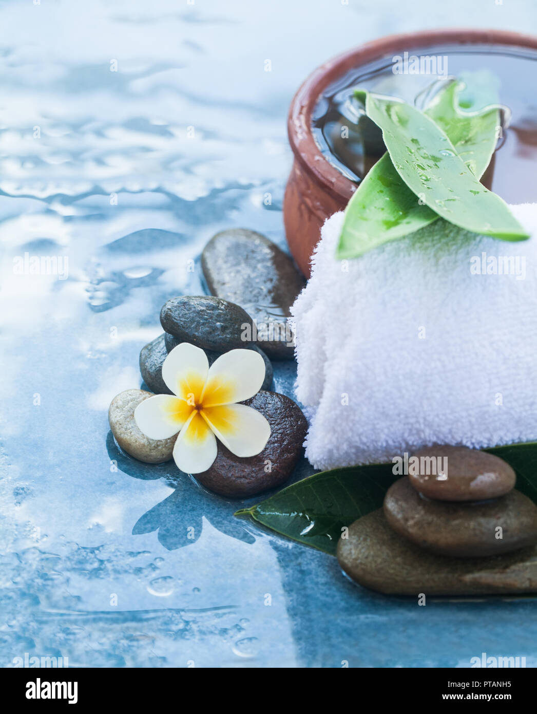 Spa objects with sunlight on blue background Stock Photo - Alamy